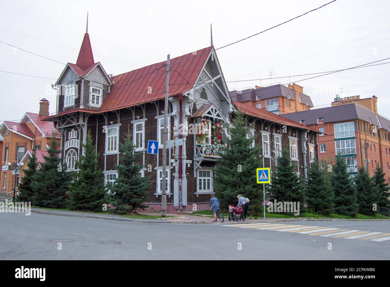 Old wooden buildings in a provincial Siberian town. Russian style in ...