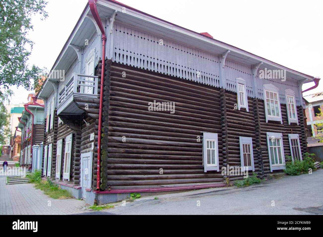 Old wooden buildings in a provincial Siberian town. Russian style in ...