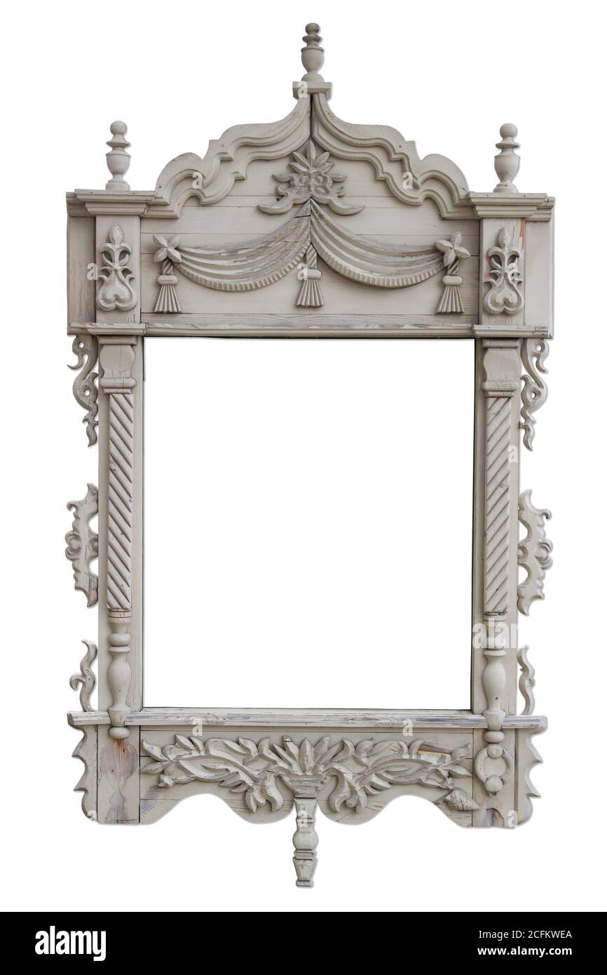 Elegant windows of a wooden house, beautiful carved platbands of ...