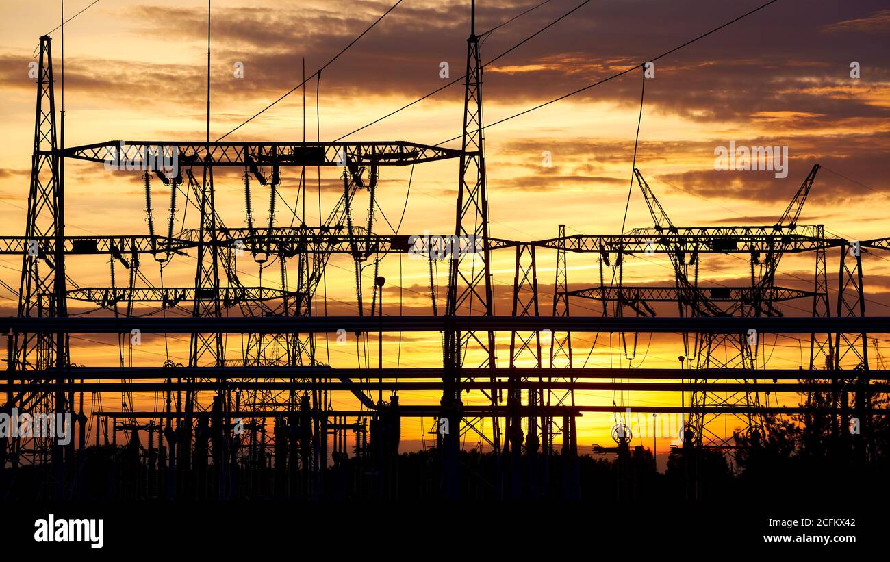 Power plant transmission infrastructure silhouette at sunset Stock ...