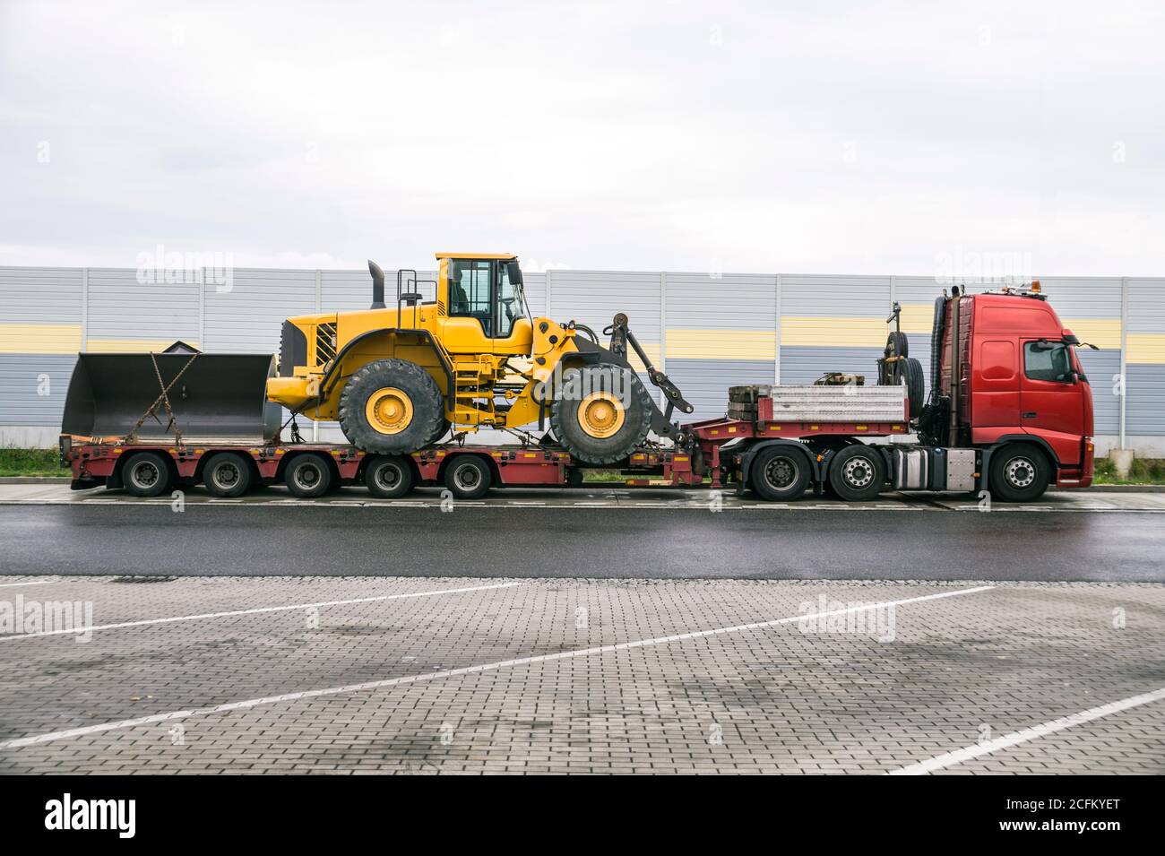 A truck with a special semi-trailer for transporting oversized loads ...