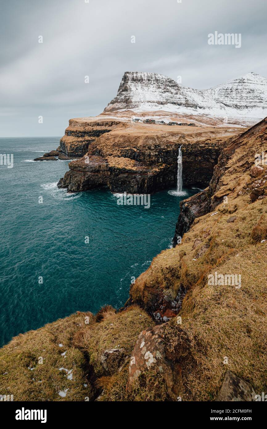 Breathtaking scenery of residential houses located near river in ...