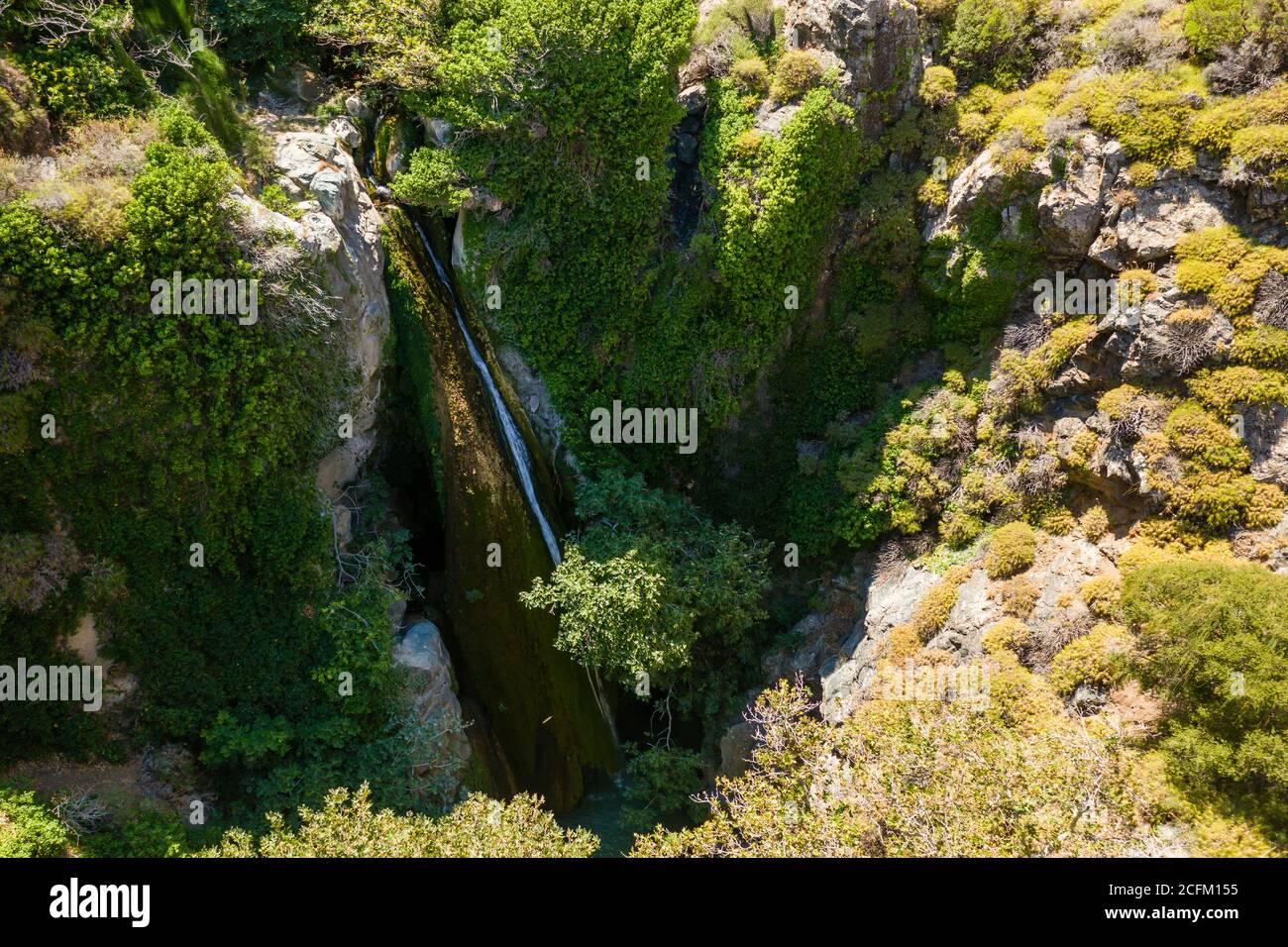 Aerial view of a narrow waterfall in a steep, rocky gorge (Richtis ...