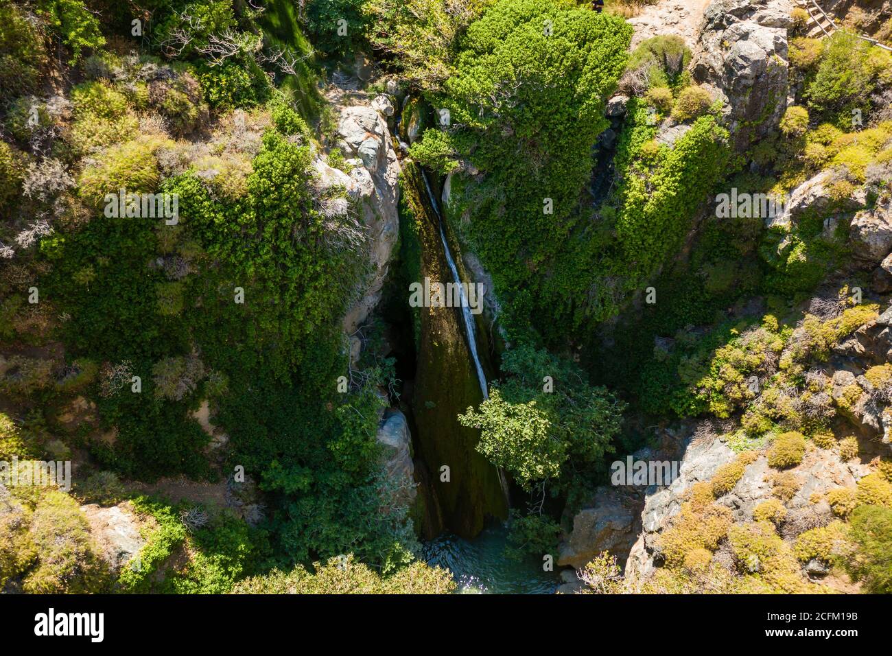 Aerial view of a narrow waterfall in a steep, rocky gorge (Richtis ...