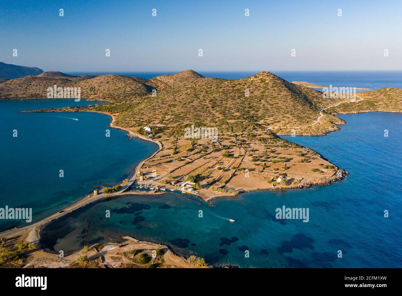 Aerial view of the crystal clear ocean and dry summer coastline of ...