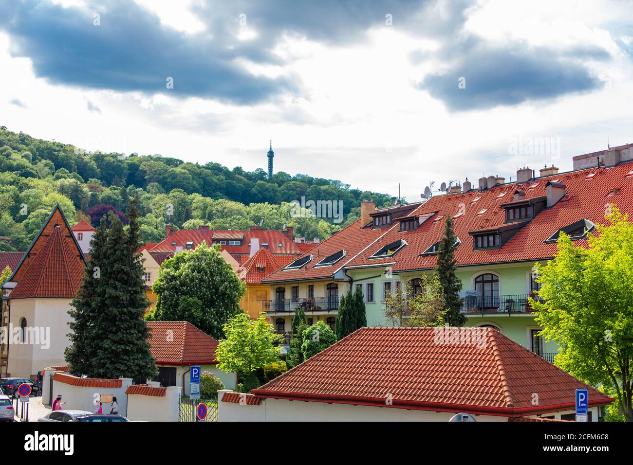 Europe street, buildings with red tiles and green trees Stock Photo - Alamy