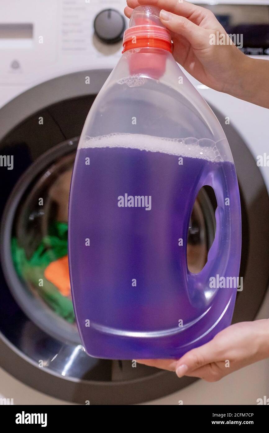 Laundry detergent bottles on Washing machine background Stock Photo - Alamy