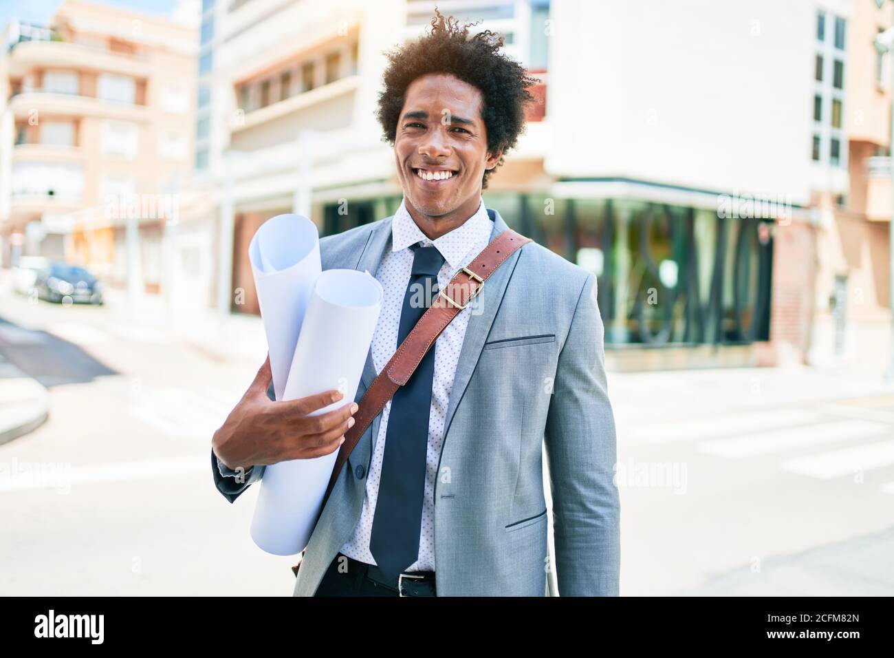 Young handsome african american architect man smiling happy. Standing ...