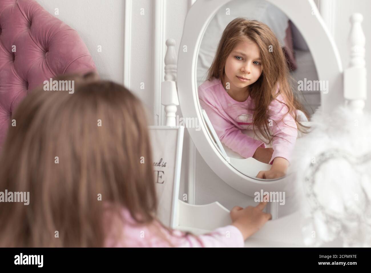 Beautiful teenage girl at the bedside mirror Stock Photo - Alamy