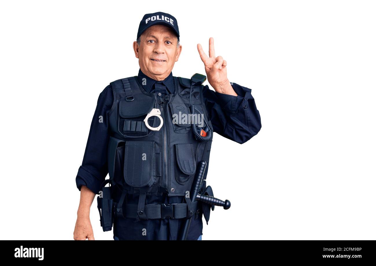Senior handsome man wearing police uniform smiling with happy face ...