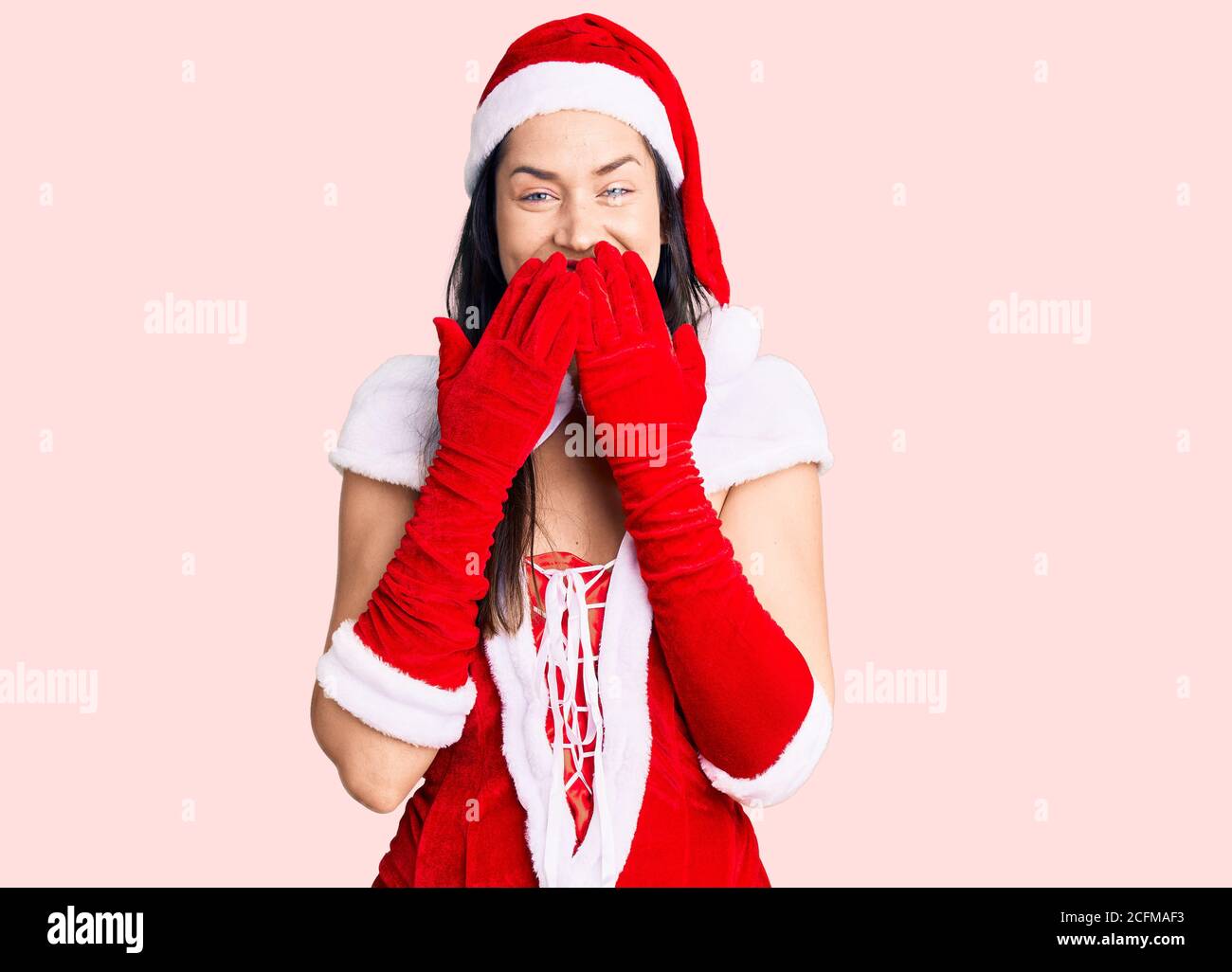 Young beautiful caucasian woman wearing santa claus costume laughing ...