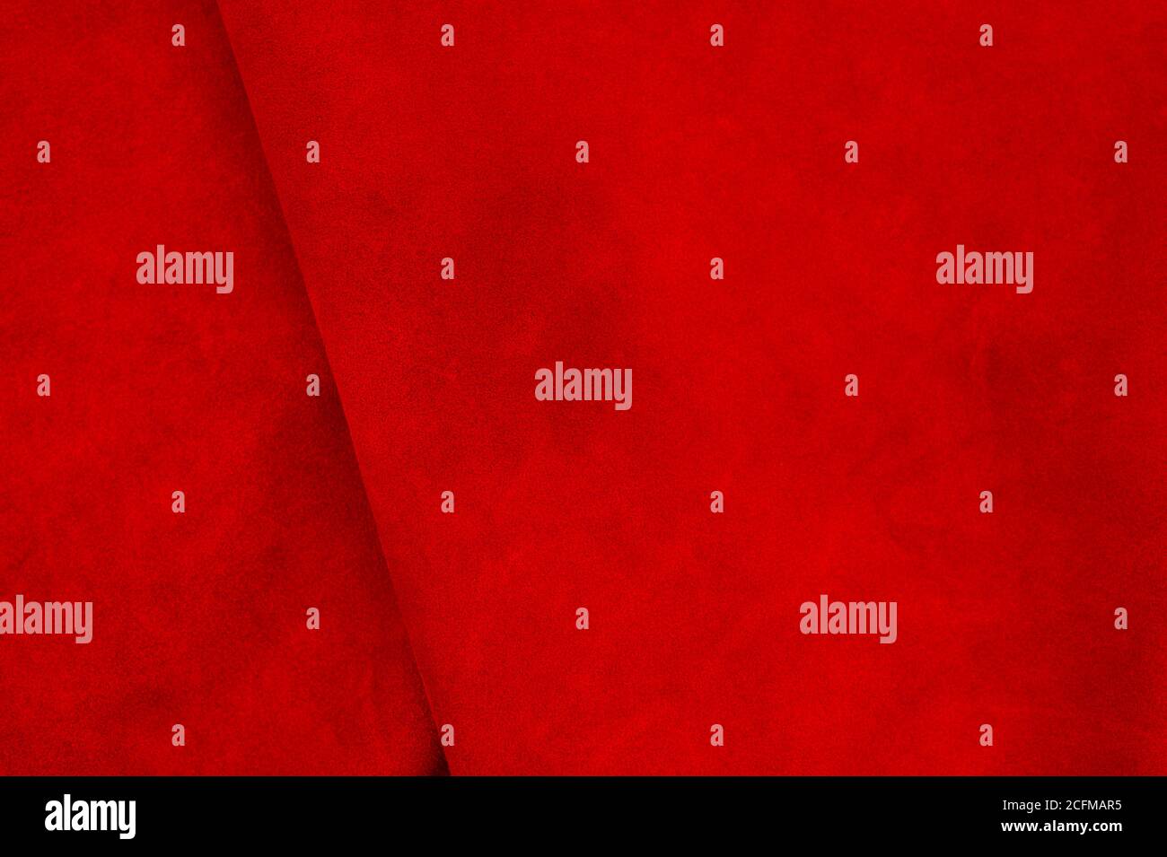 Dark red matte background of suede fabric, closeup. Velvet texture of ...