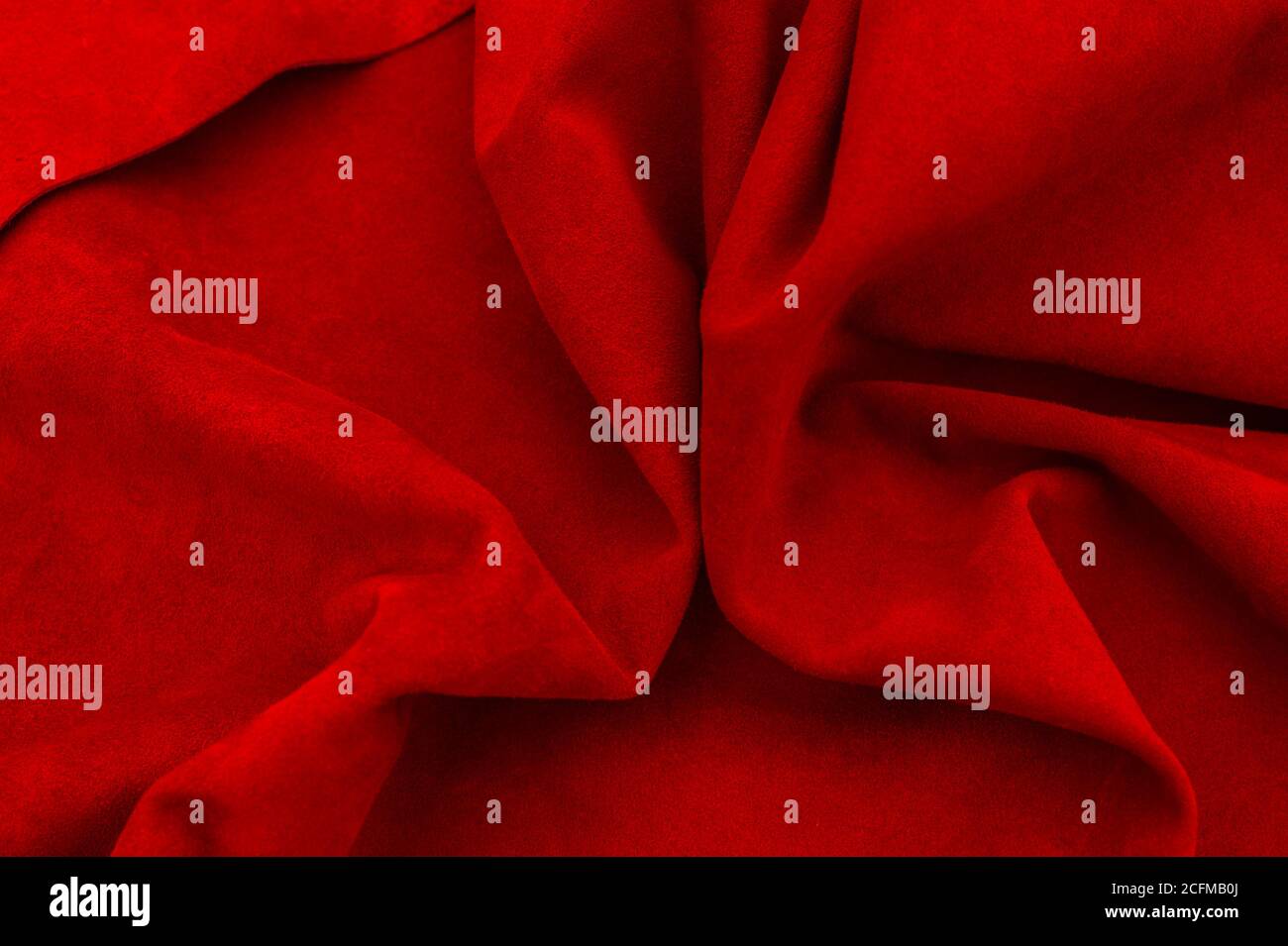 Dark red matte background of suede fabric, closeup. Velvet texture of ...