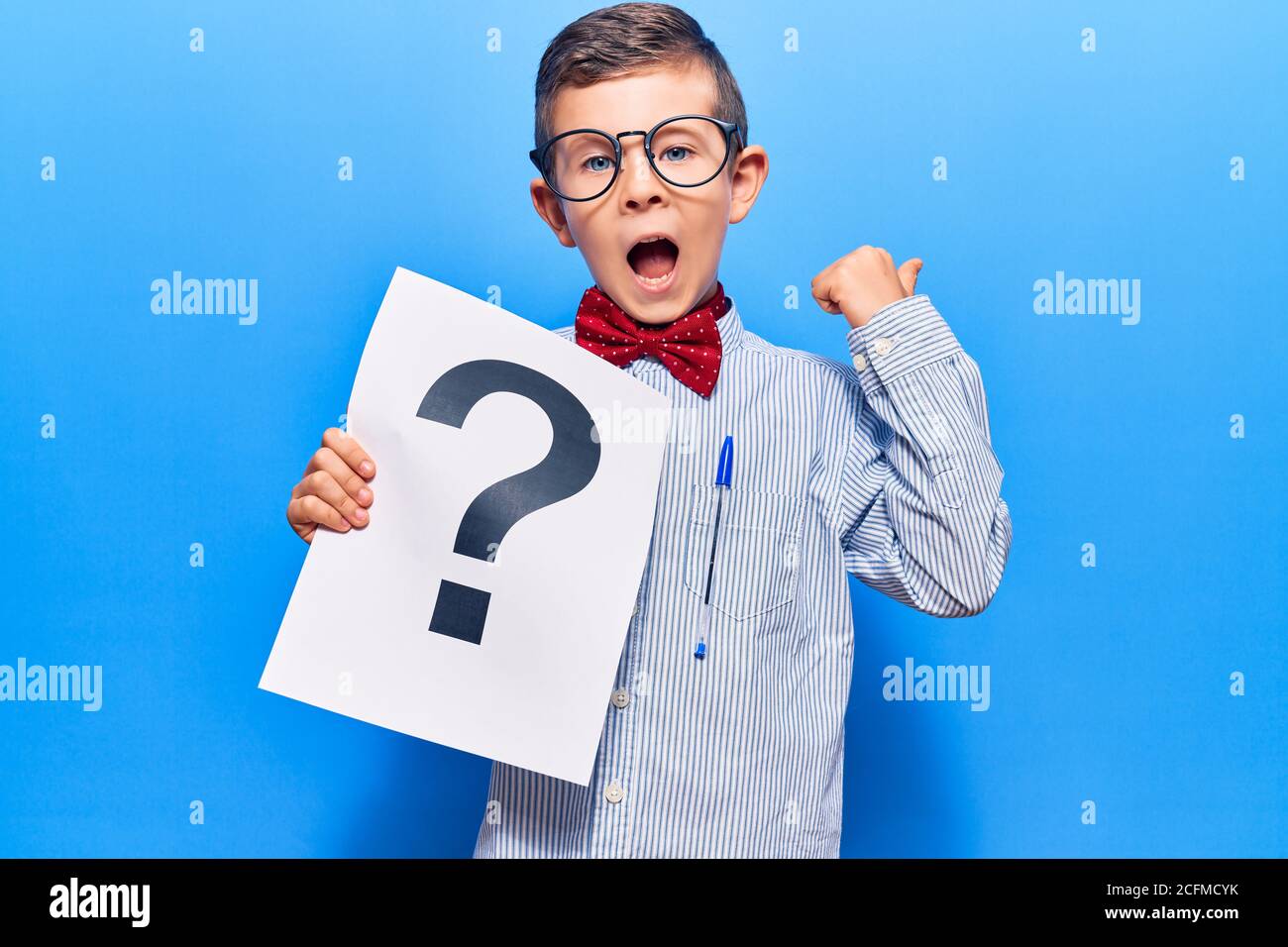 Cute blond kid wearing nerd bow tie and glasses holding question mark ...