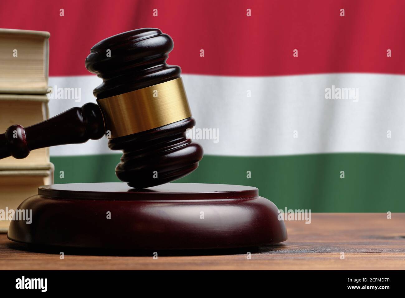 Justice and court concept in Hungary. Judge hammer on a flag background ...