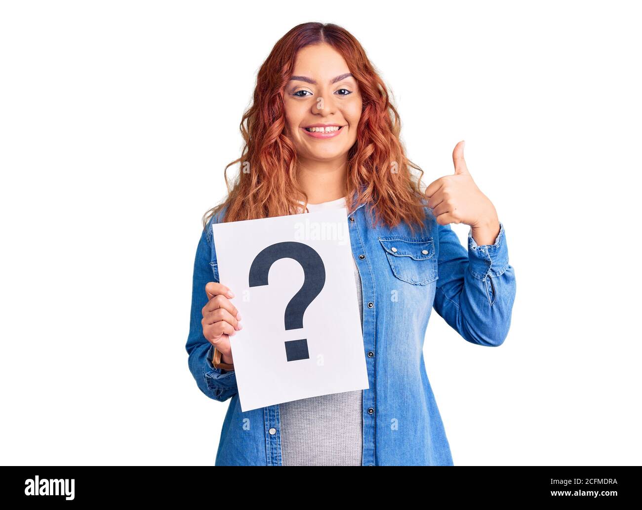 Young latin woman holding question mark smiling happy and positive ...