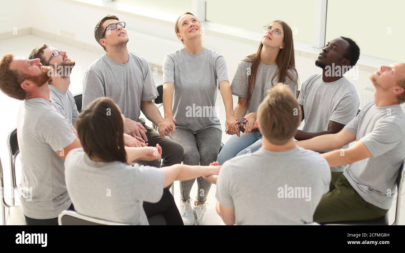 group of concentrated people sitting in a circle Stock Photo - Alamy