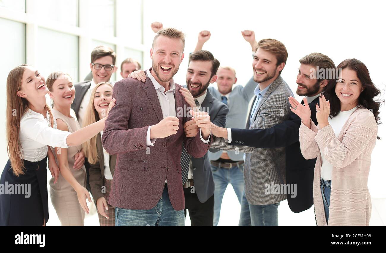 creative team congratulating their leader. success concept Stock Photo ...