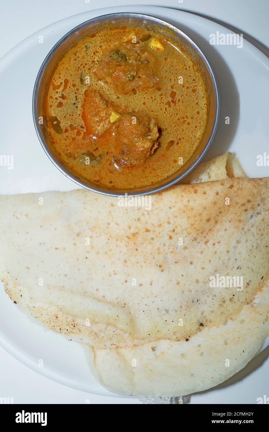 South Indian Dosa with chicken curry, Very popular breakfast Stock ...