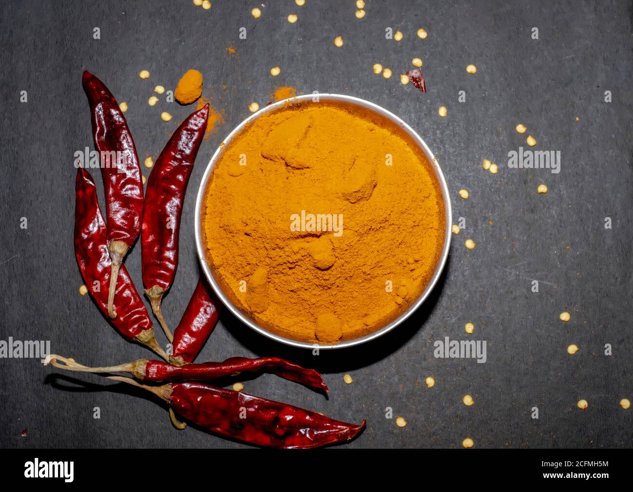 Chili powder and fresh and dried peppers on tables Stock Photo - Alamy