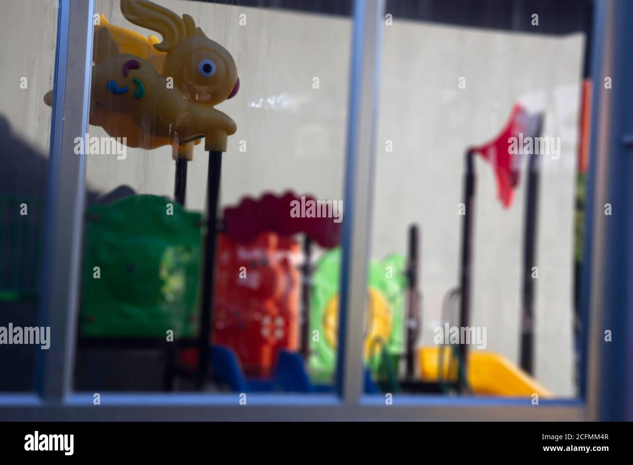 Children playground reflection on window glass, stock photo Stock Photo ...