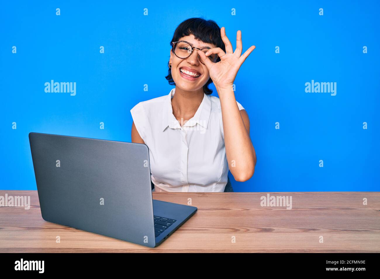 Beautiful brunettte woman working using computer laptop smiling happy ...