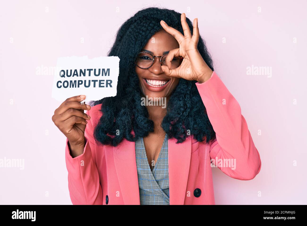 Beautiful african woman holding quantum computer banner smiling happy ...