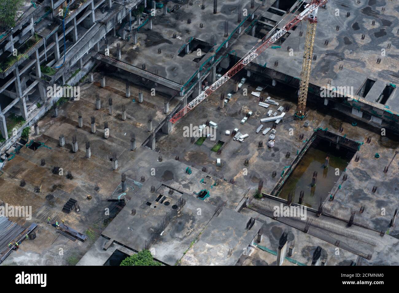 Top view of the construction site of a large building after rain. Piles ...