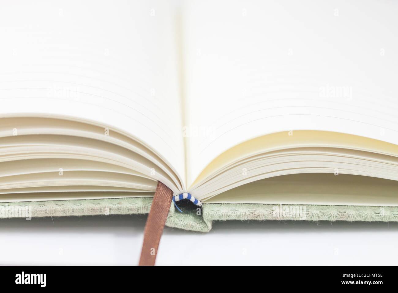 Closeup opened notebook on white background, stock photo Stock Photo ...