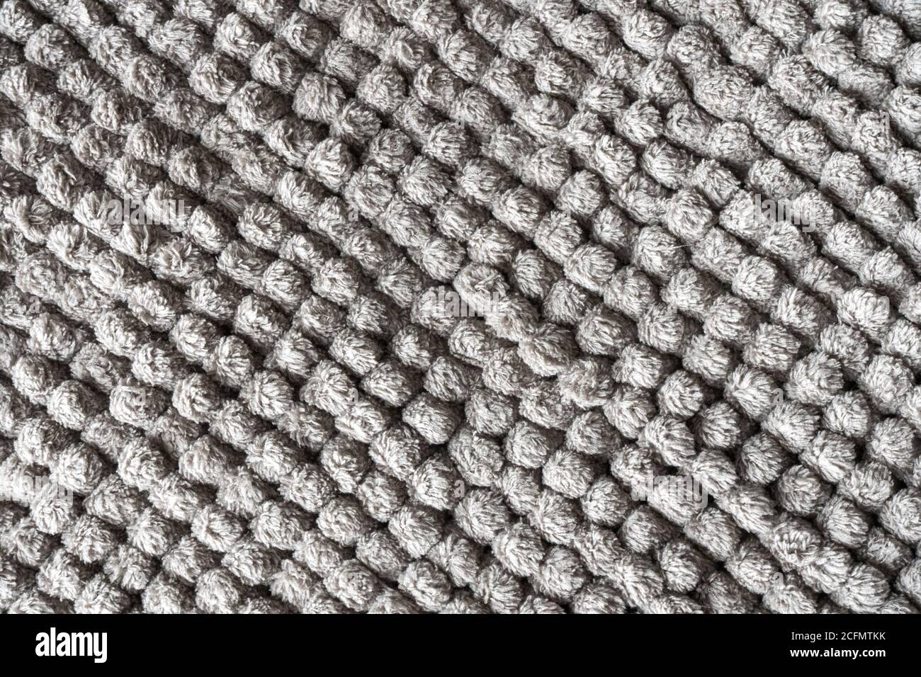 Texture of a gray blanket made of small balls Stock Photo - Alamy