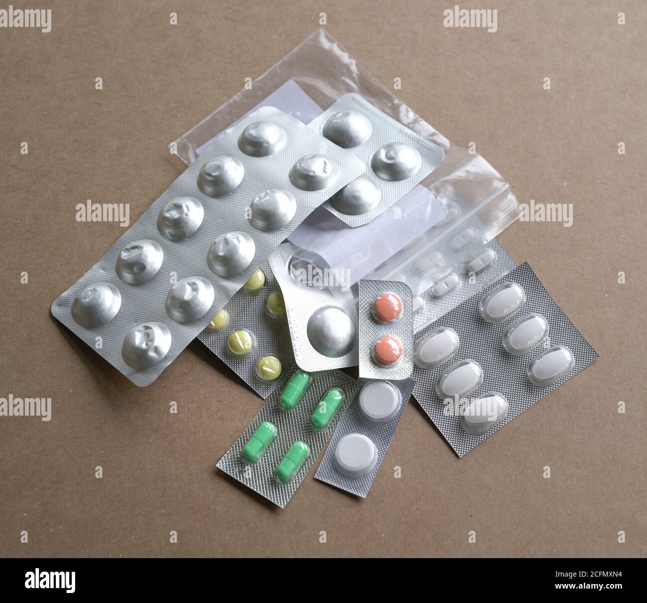 Package of medicine in tablet and pills form, in various colors ...
