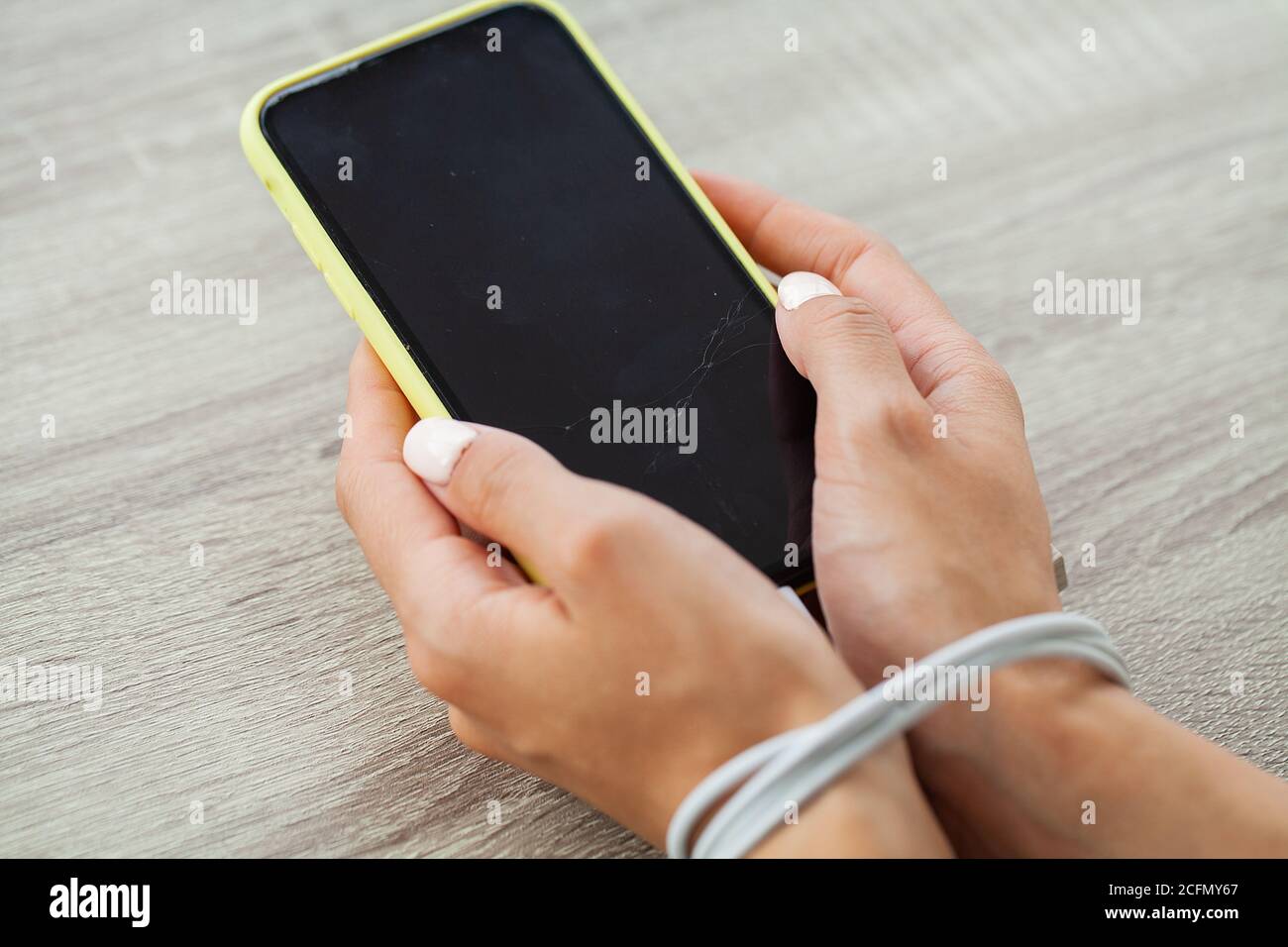 Close up top view of woman hands connected with wire cable to ...