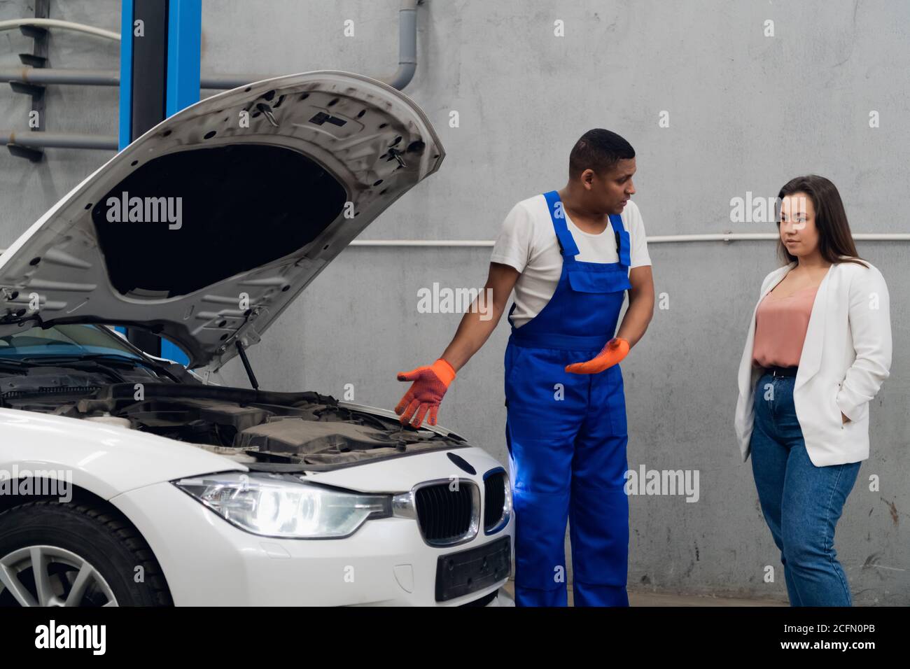 Mechanic talking client showing work hi-res stock photography and ...