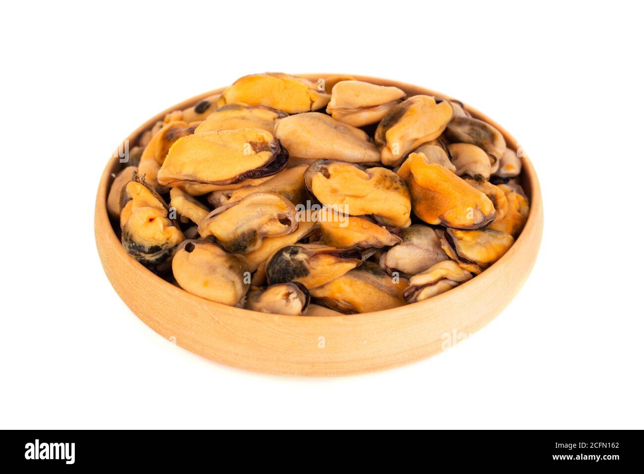 Fresh raw small mussel meat in a wooden japaneese plate studio isolated ...