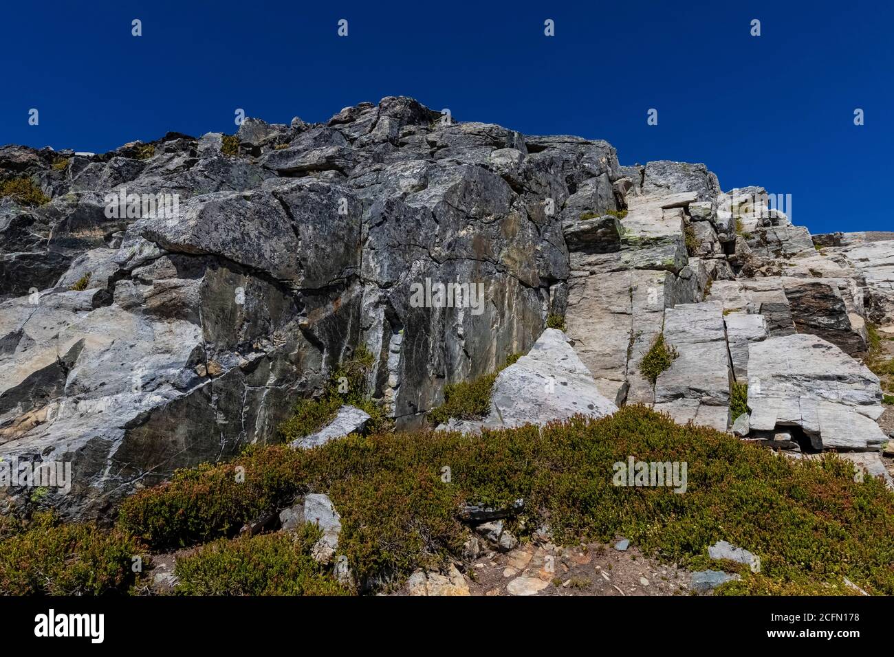Rocky cliffs along the Sahale Arm Trail route through talus in North ...