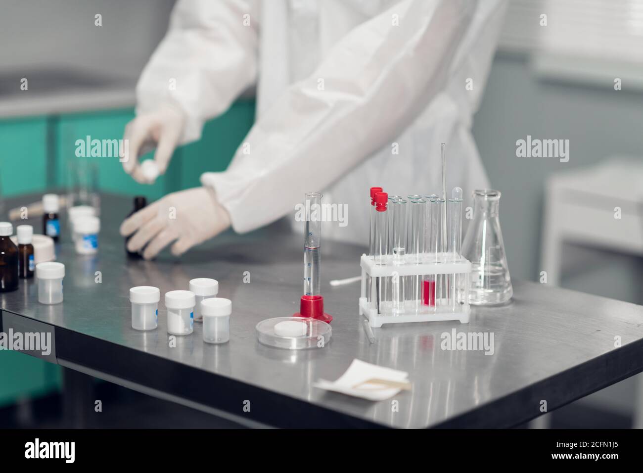 Scientist holding test tubes biohazard hi-res stock photography and ...