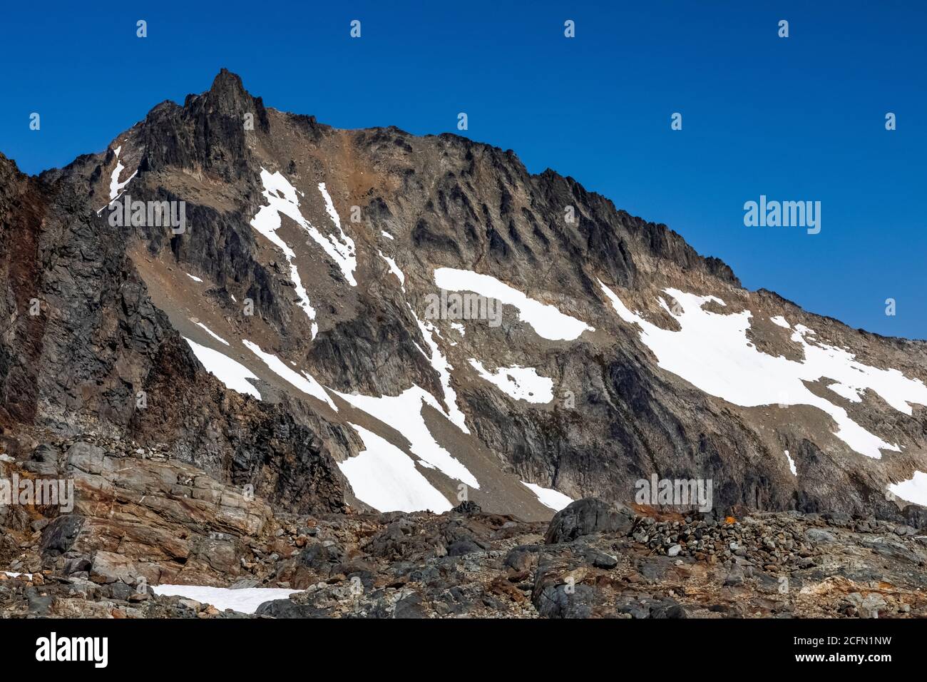 Climbers' campsite, partly protected by a stone wall, at Sahale Glacier ...