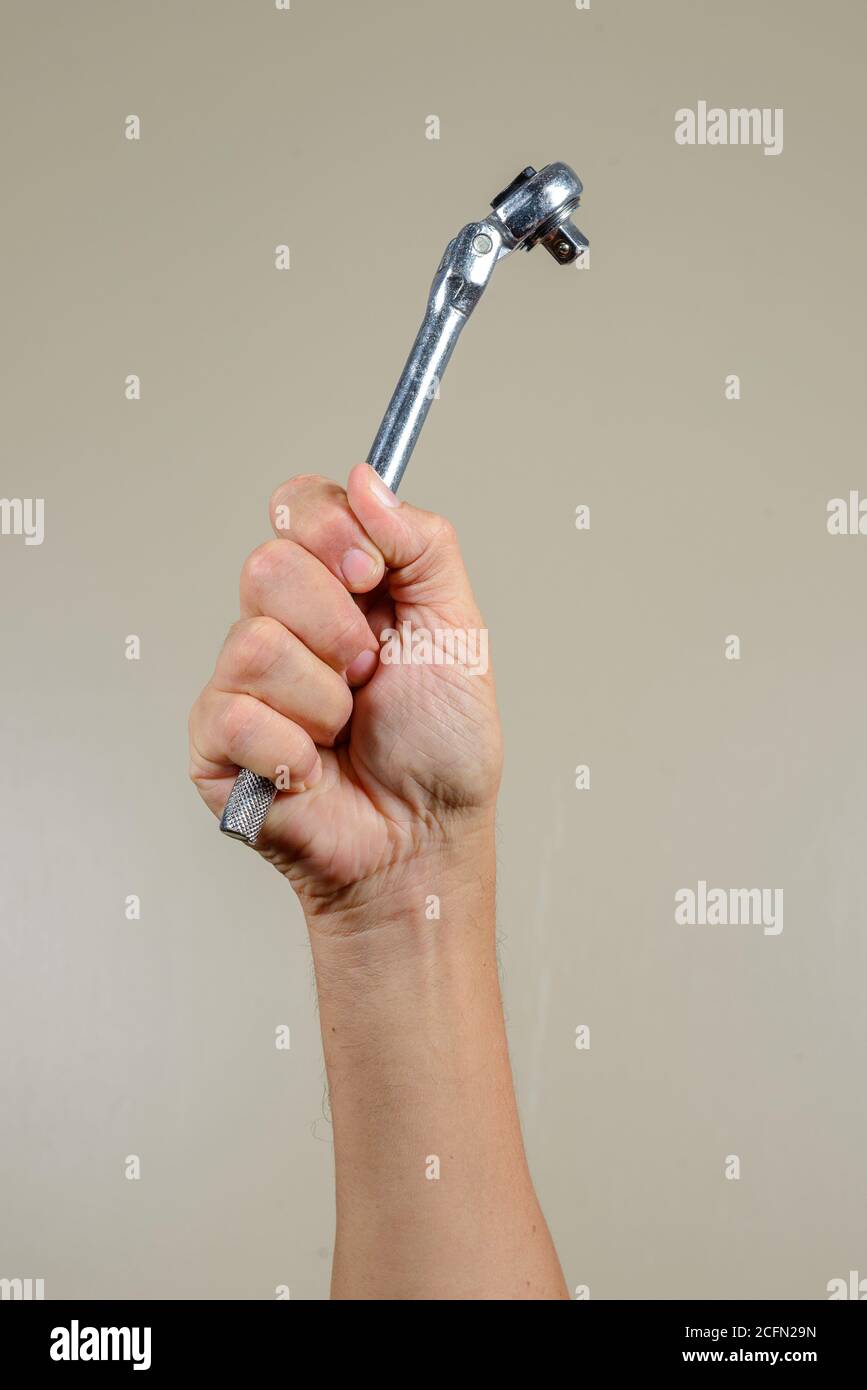industry worker hand holding mechanical tool Stock Photo - Alamy