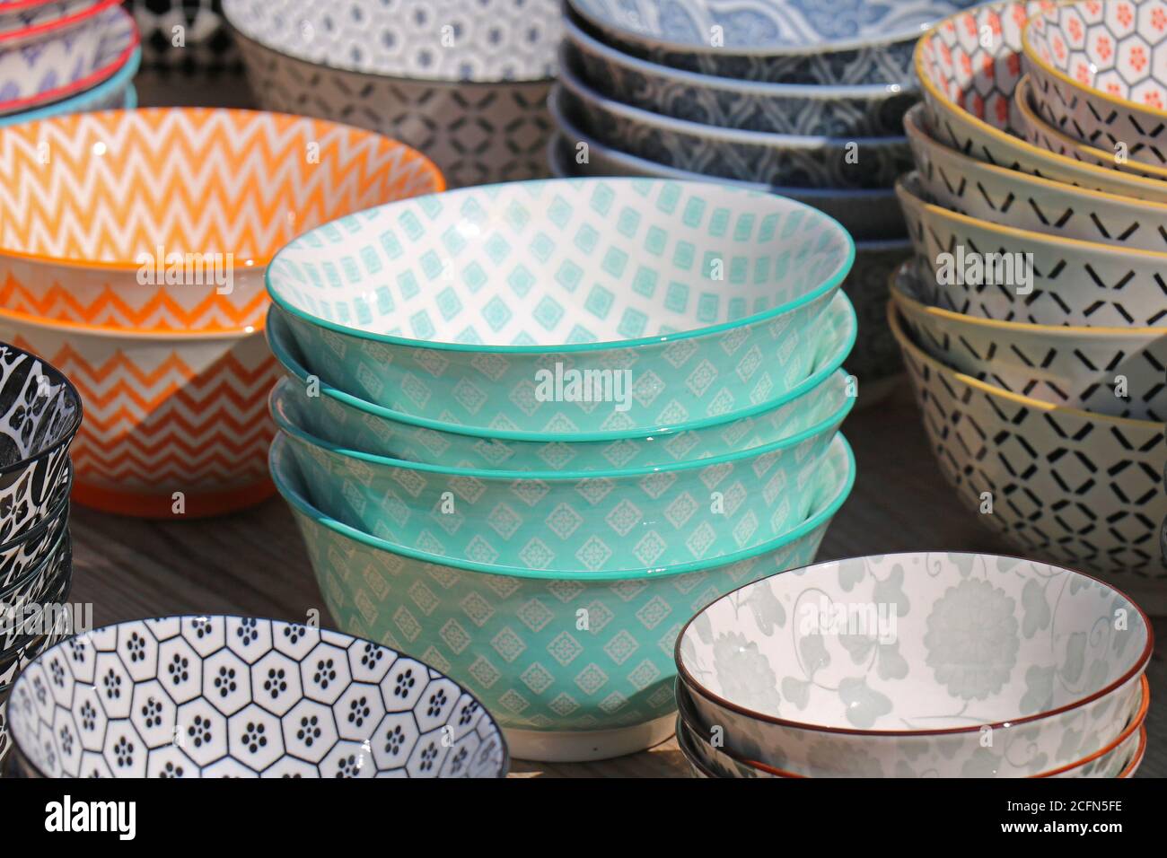 Colorful ceramic bowls piles with modern design Stock Photo - Alamy