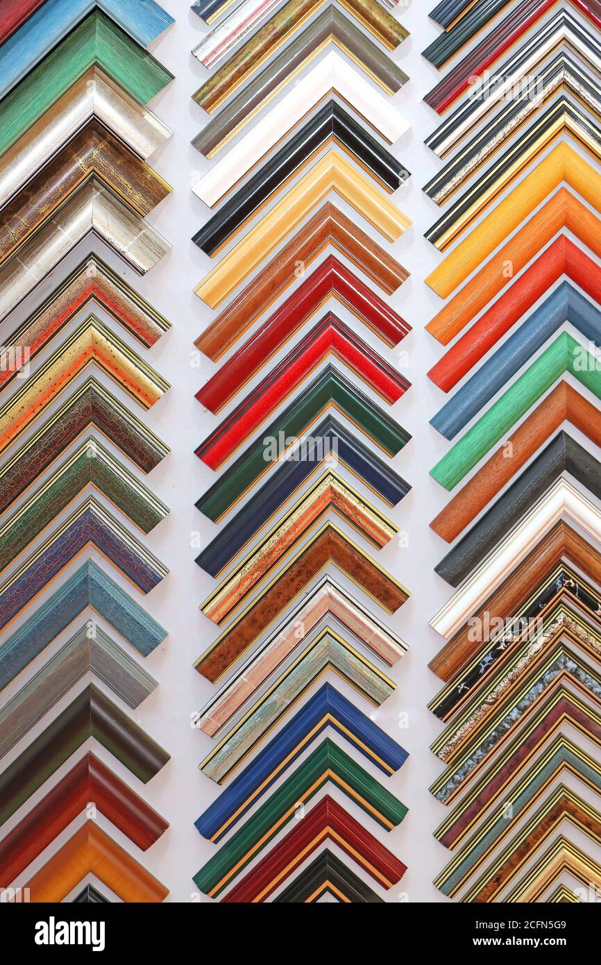 Modern colorful wooden frames corners samples on wall Stock Photo - Alamy