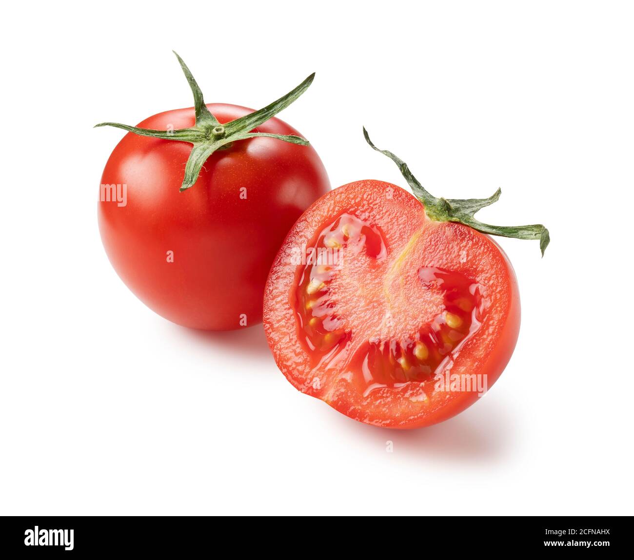 Shooting tomatoes and cut tomatoes placed on a white background from an ...