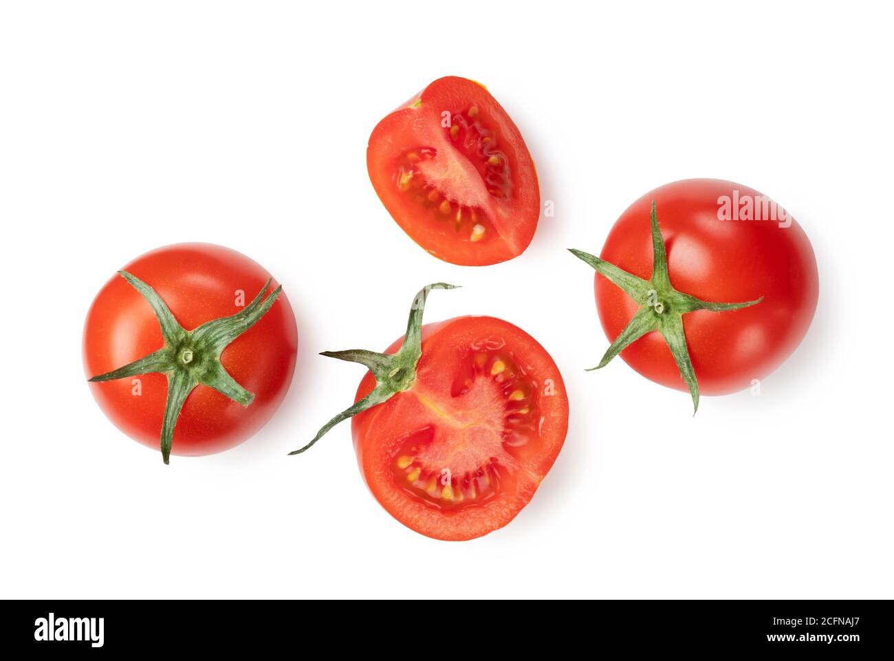 Tomatoes placed on white background and cut tomatoes shot from above ...