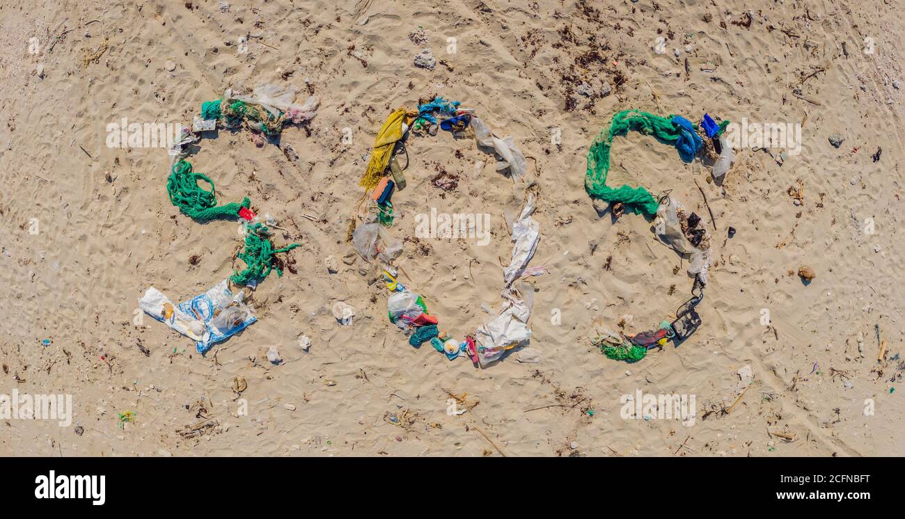 Environmental problem. Ecology concept. Plastic on the beach with sos ...