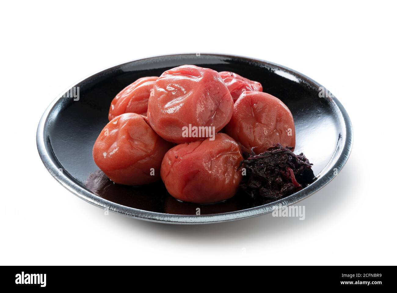 Japanese pickled plums on a white background. (Kishu Nanko Ume Stock Photo - Alamy