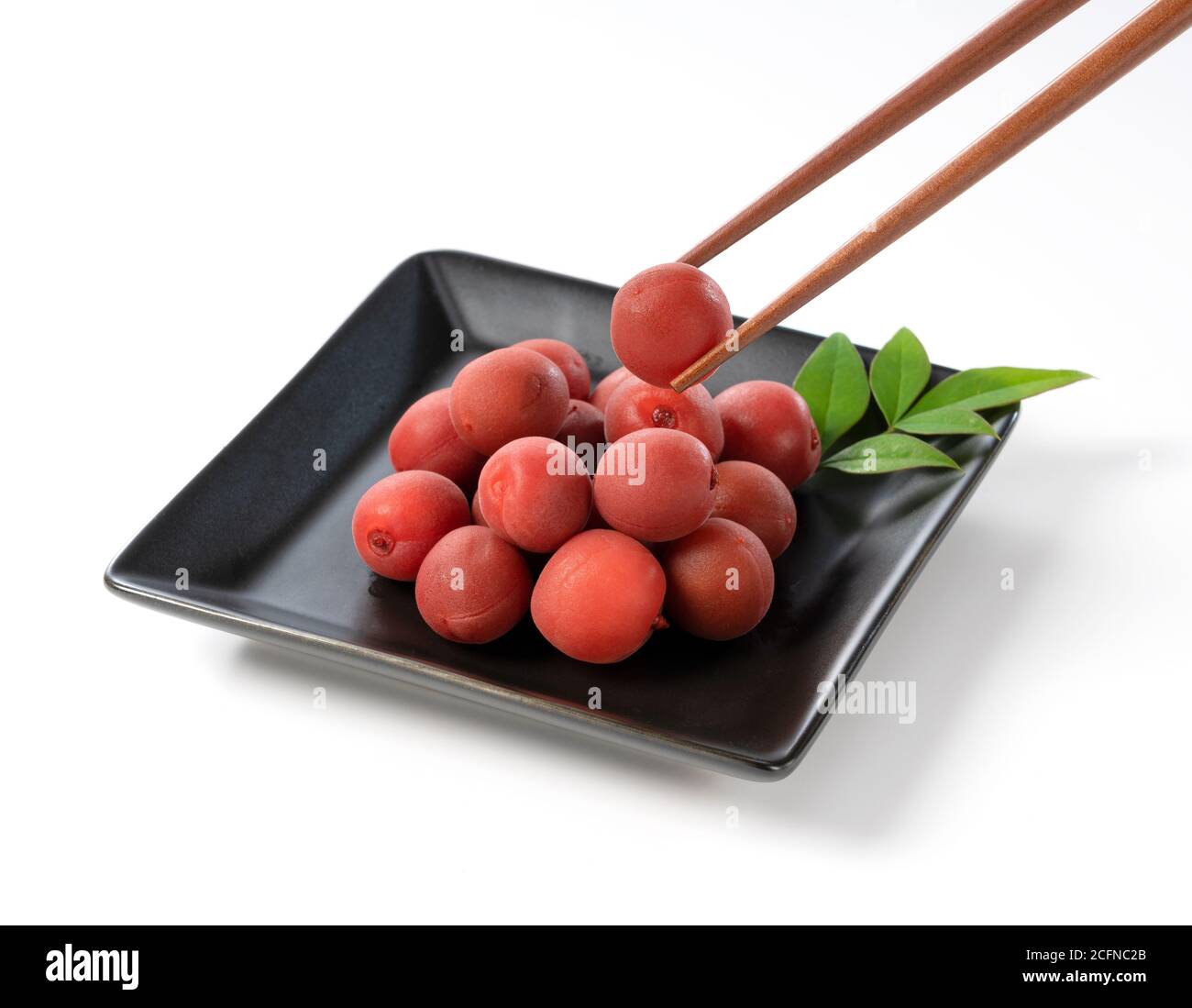 Japanese pickled plums on a white background. I'll hold it up on the ...