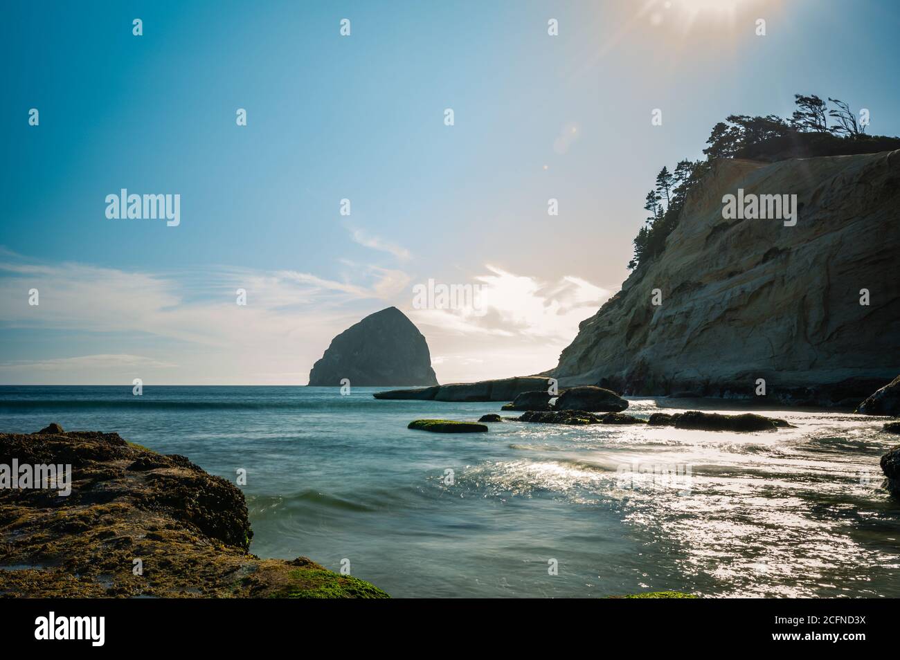 Large sandstone cliffs of Cape Kiwanda in Oregon during summer day ...