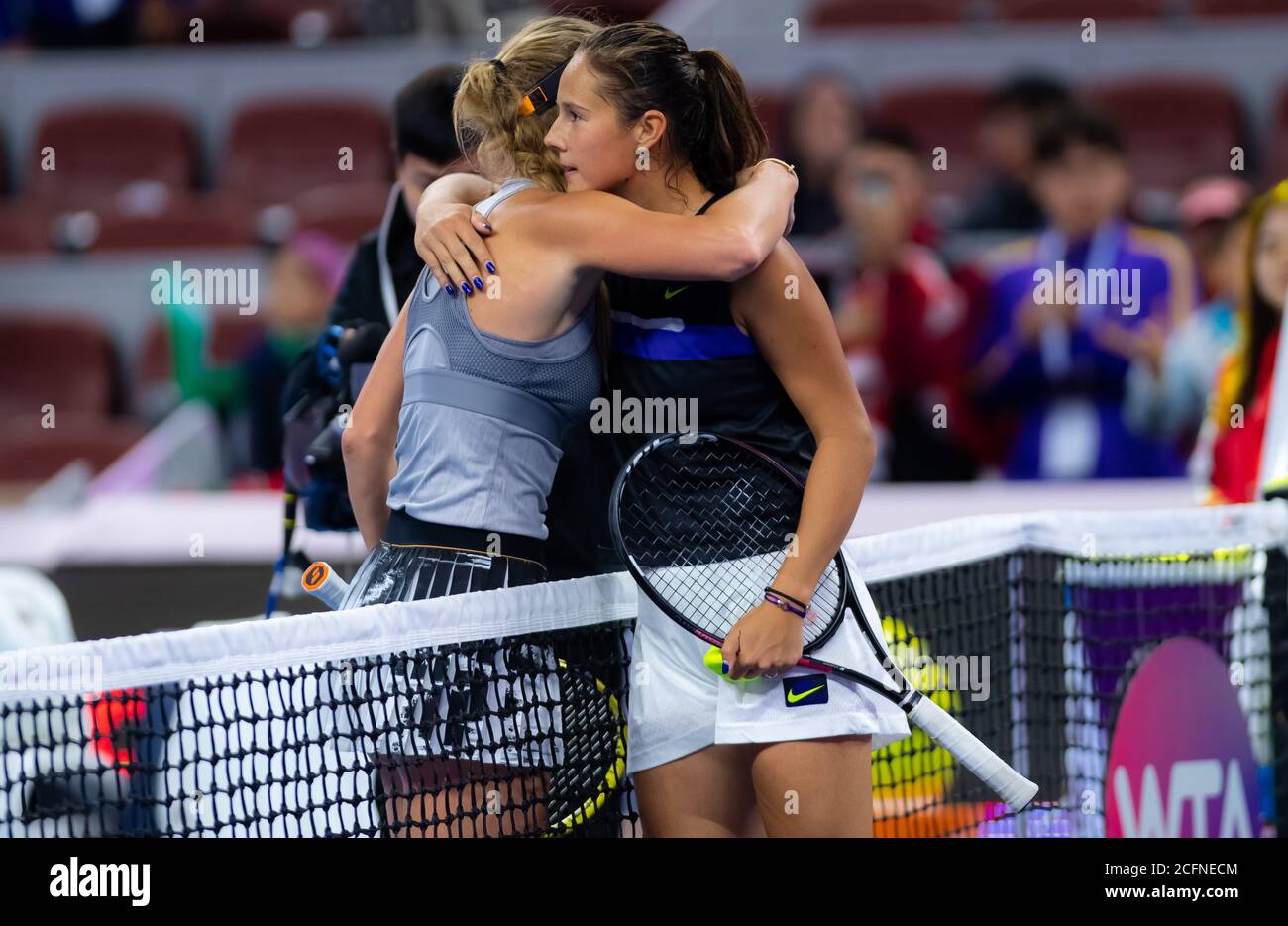 Caroline Wozniacki of Denmark & Daria Kasatkina of Russia at the net ...