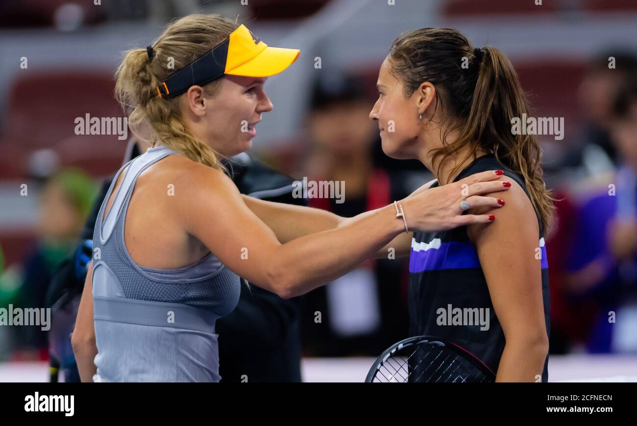 Caroline Wozniacki of Denmark & Daria Kasatkina of Russia at the net ...
