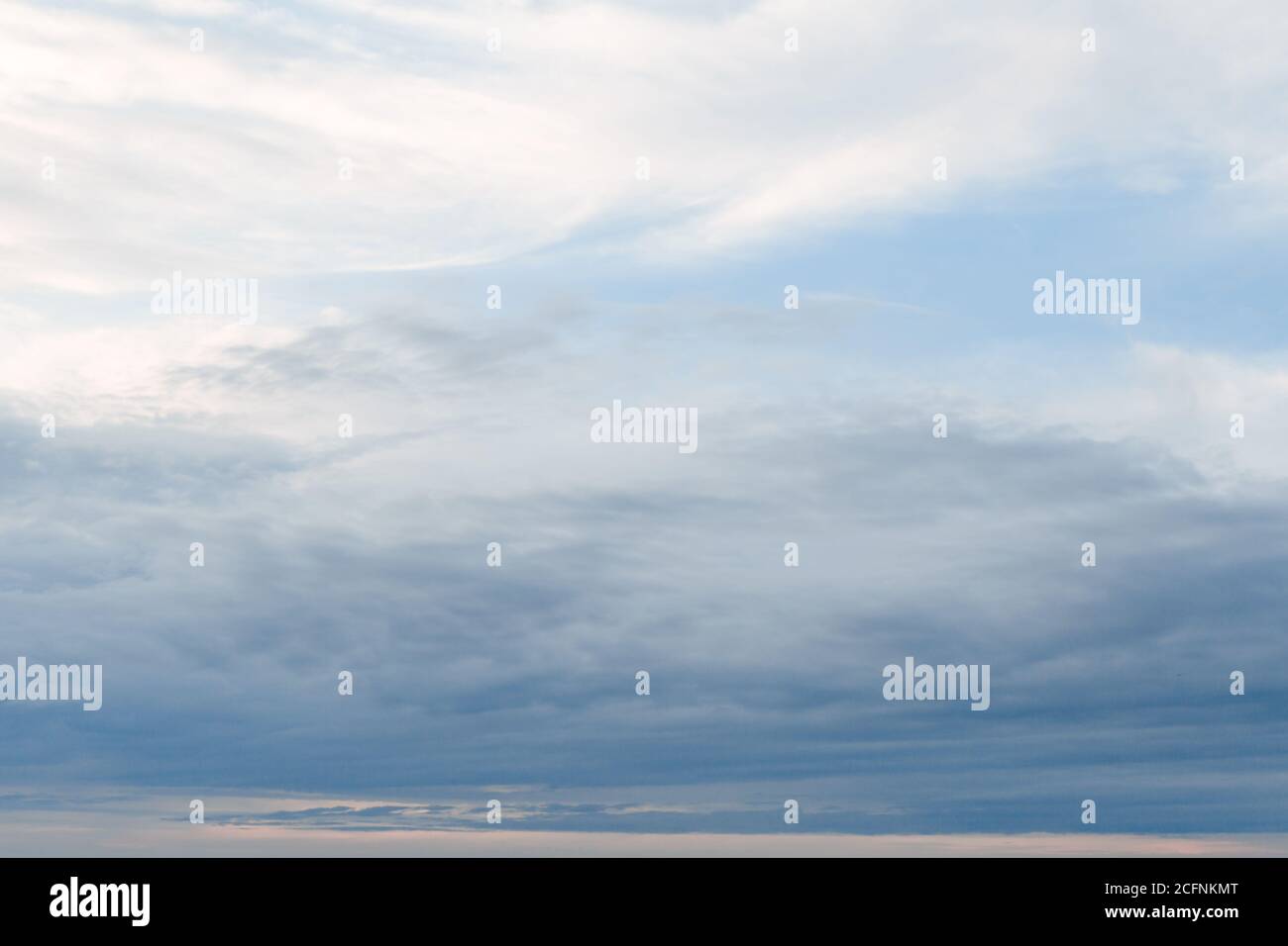 Blue sky with white clouds. Background from the cloudy sky. Long and ...