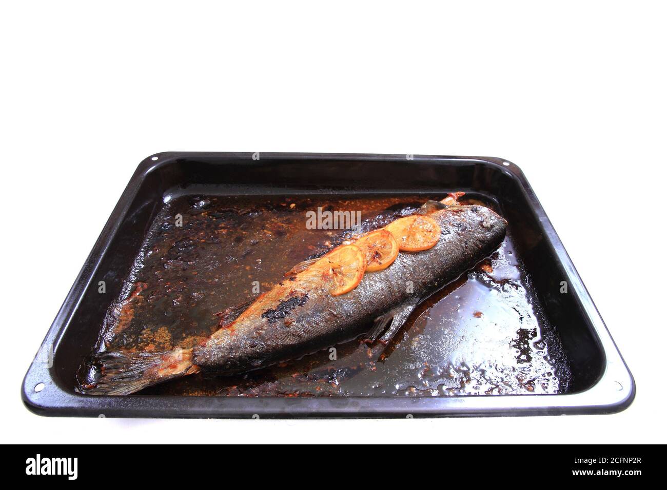 baked salmon fish isolated on the white background Stock Photo - Alamy